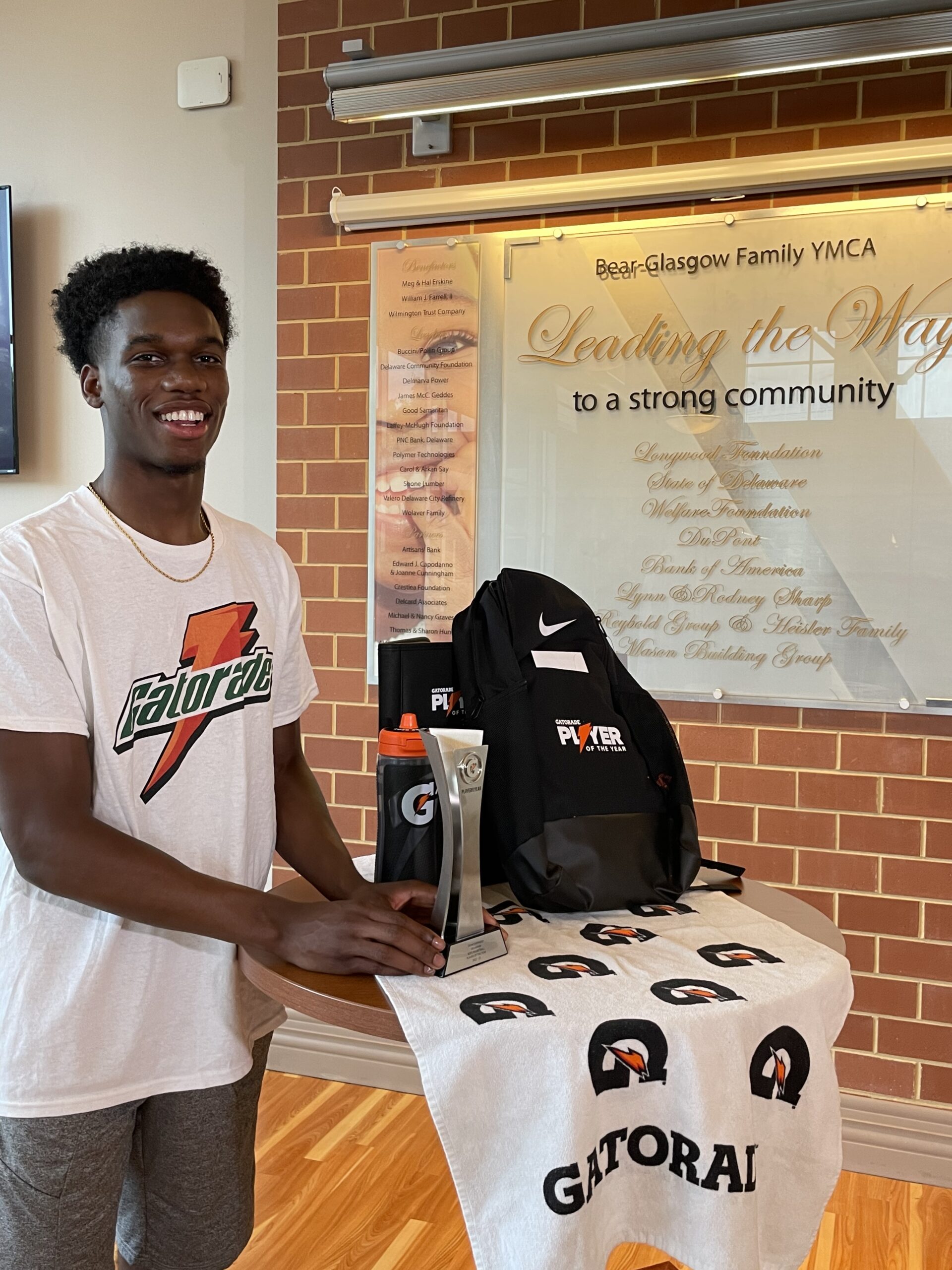 YMCA Donation - Basketball Star Dean Shepherd Gives Back